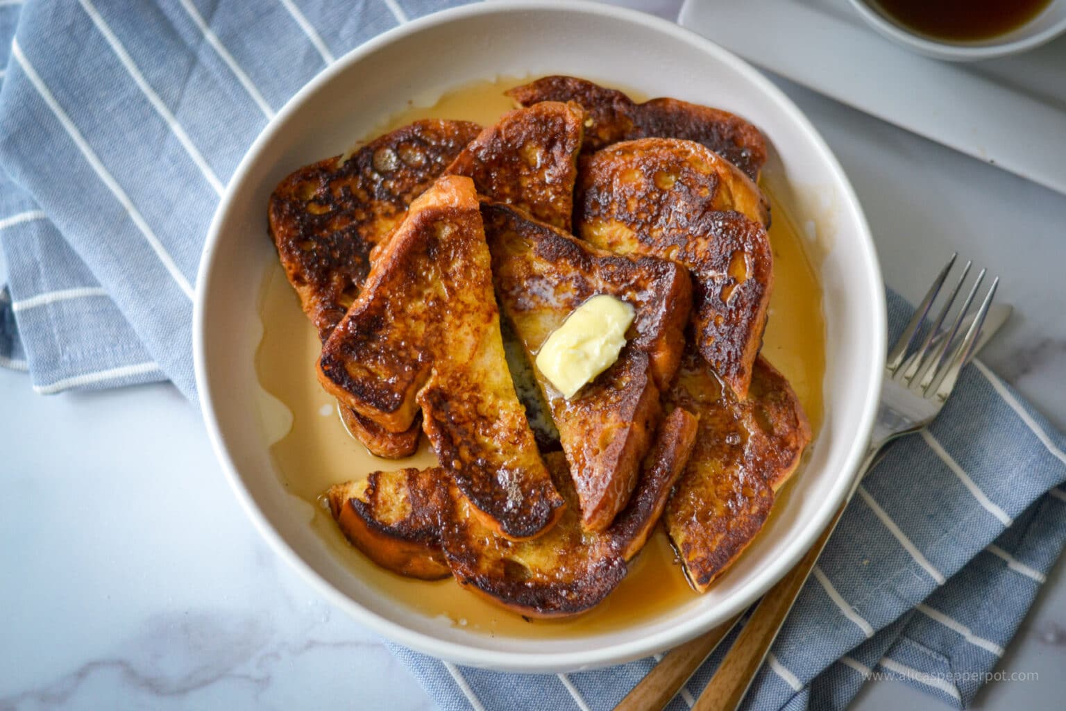 french-toast-with-butter-in-a-white-bowl-horizontal » Alica's Pepperpot